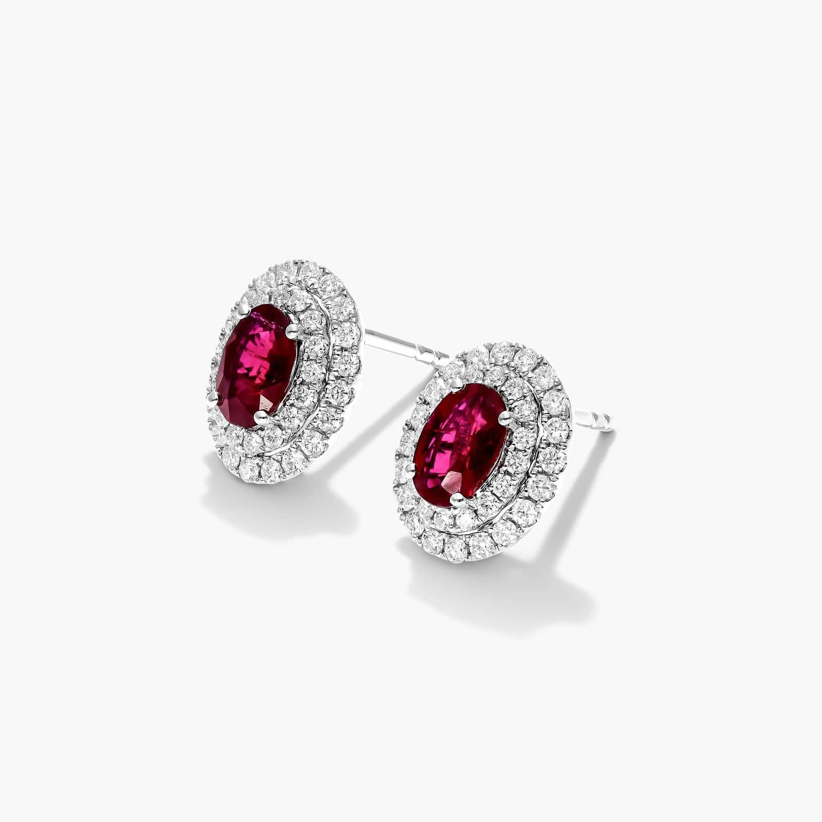 Oval Cut Ruby And Diamond Double Halo Earrings In 18K White Gold